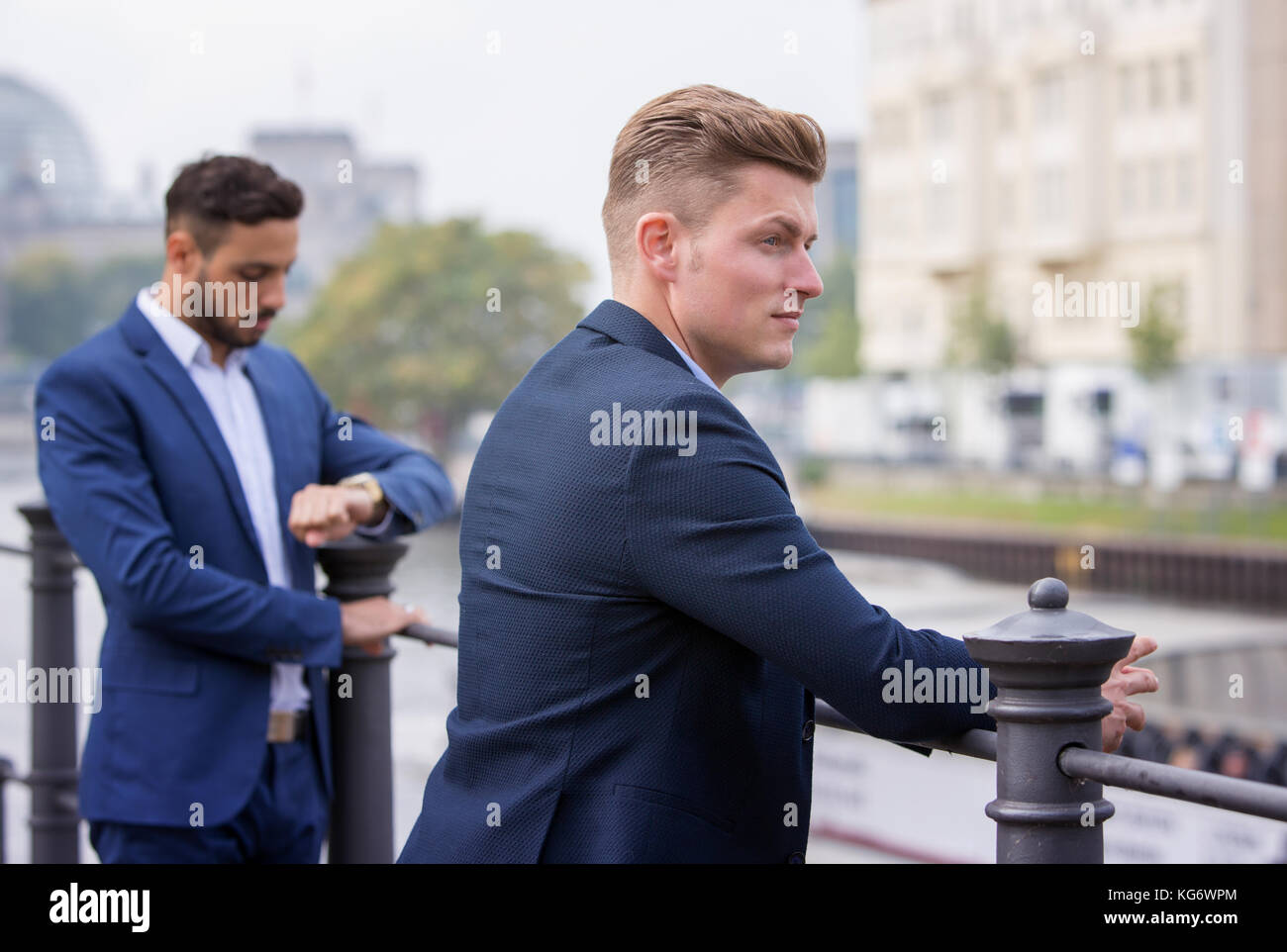 portrait of two handsome businessmen standing outside and waiting Stock ...