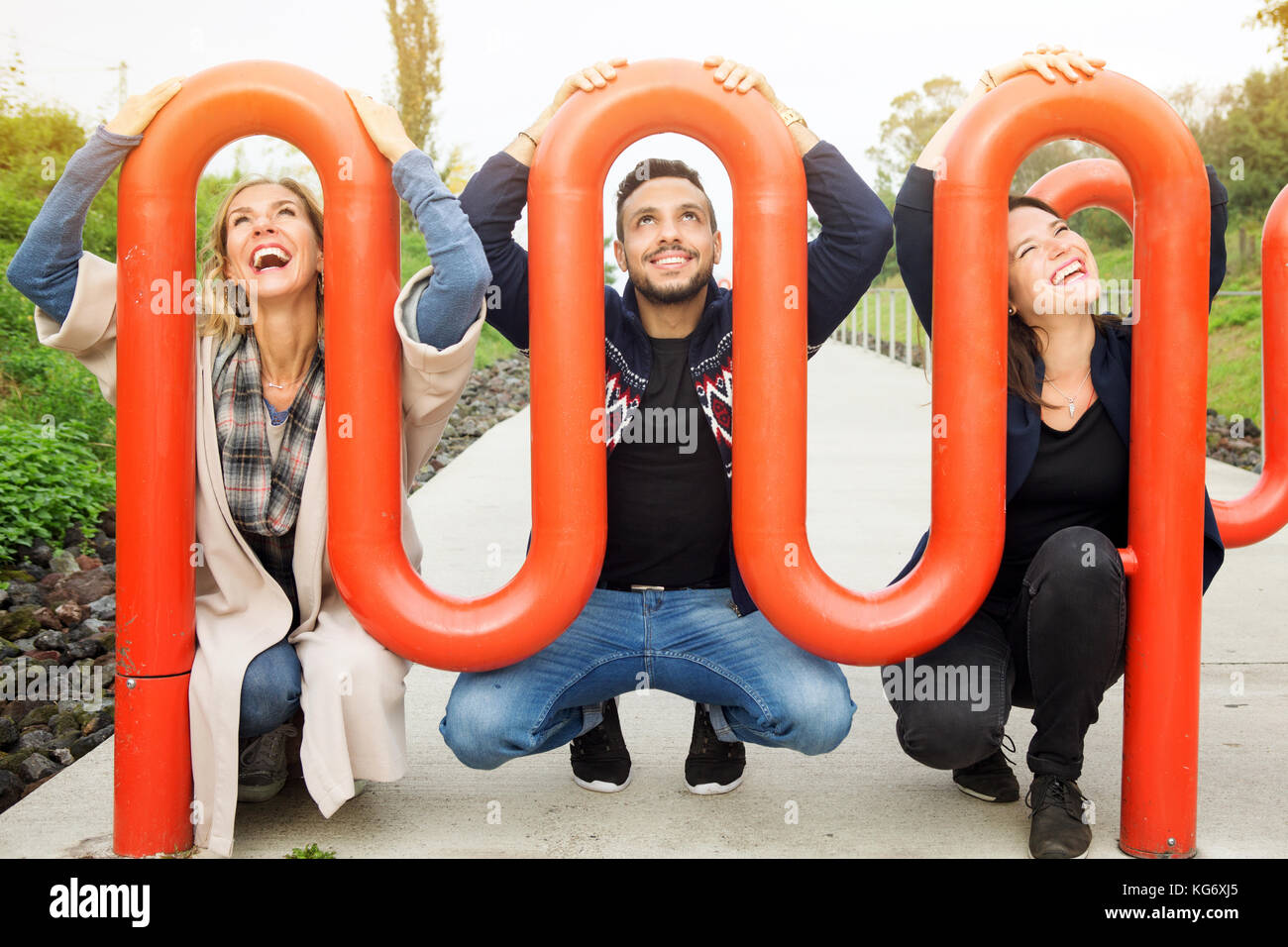 three friends having fun outdoors and enjoying the sun in autumn Stock ...