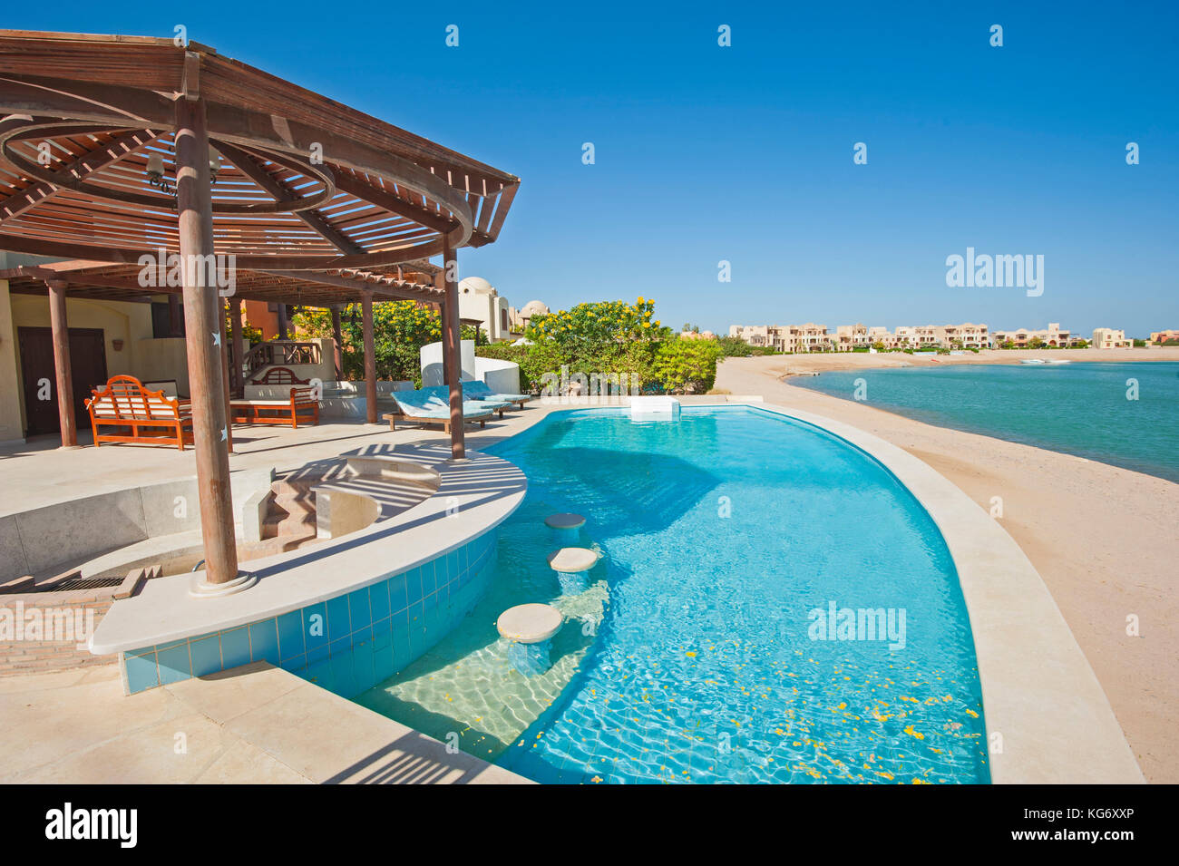 Luxury villa show home in tropical summer holiday resort with swimming ...