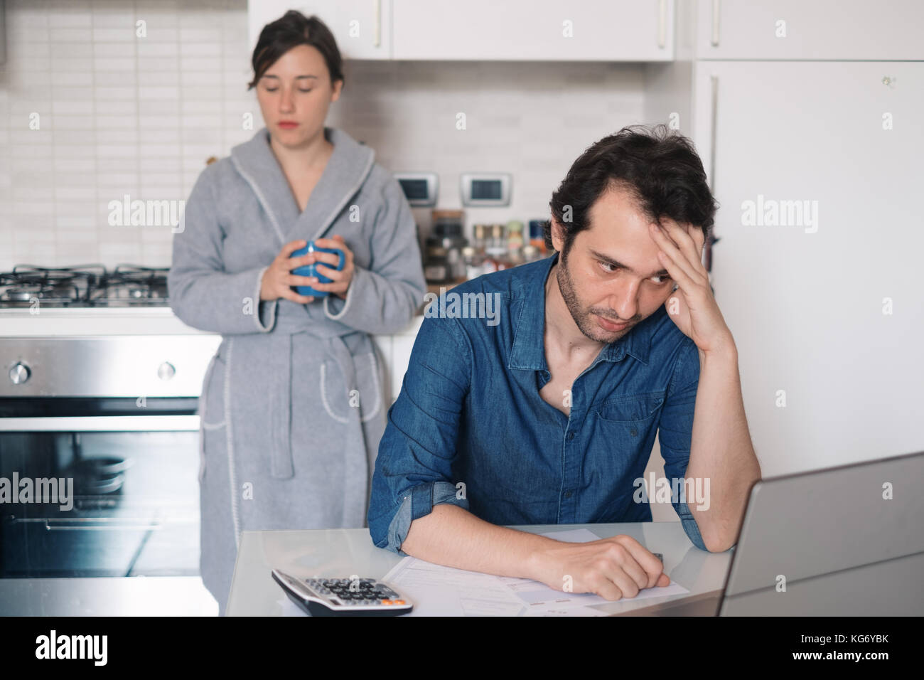 Sad family man trying to find a solution for taxes and debts Stock ...