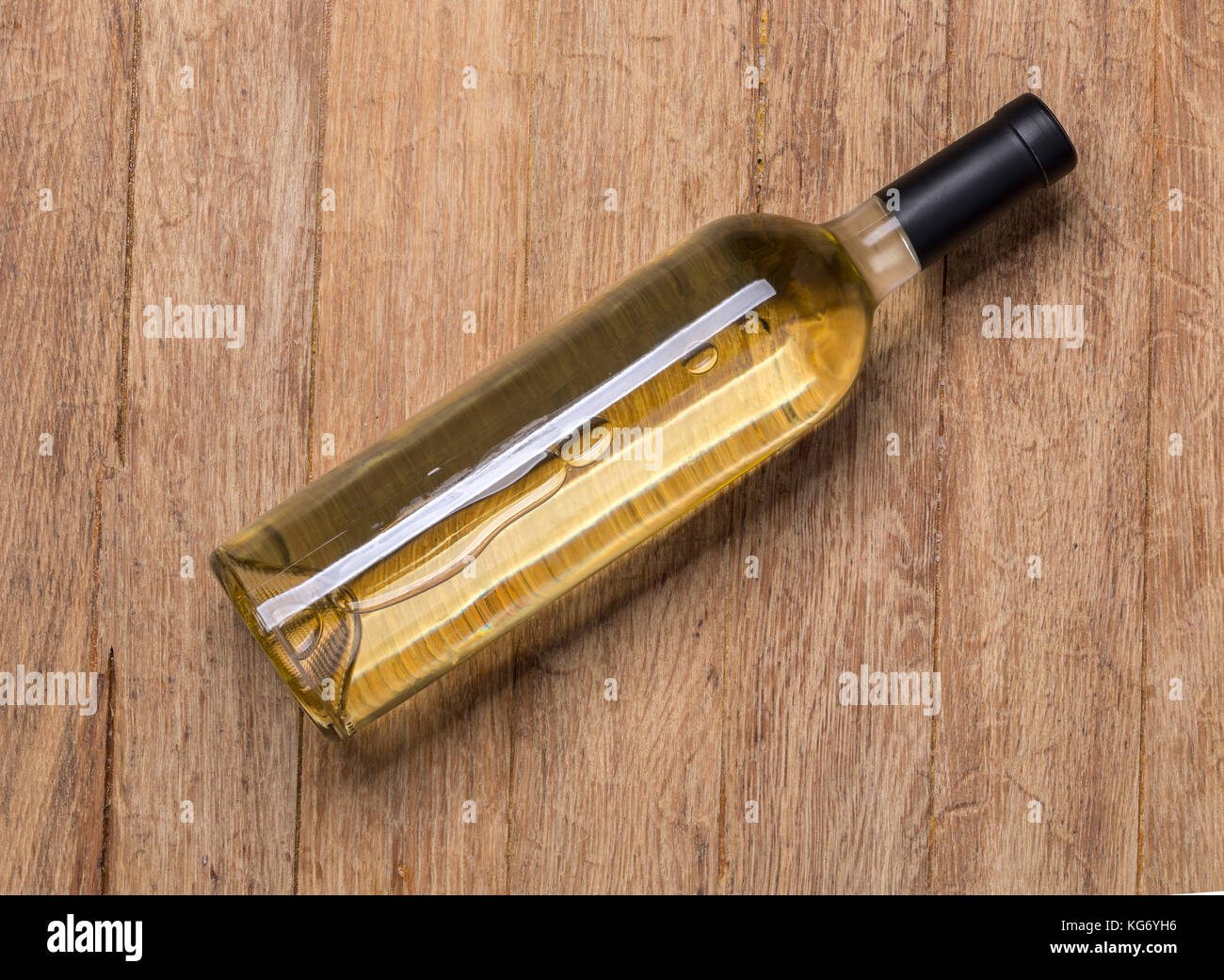 Glass bottle of wine on wooden table background Stock Photo - Alamy