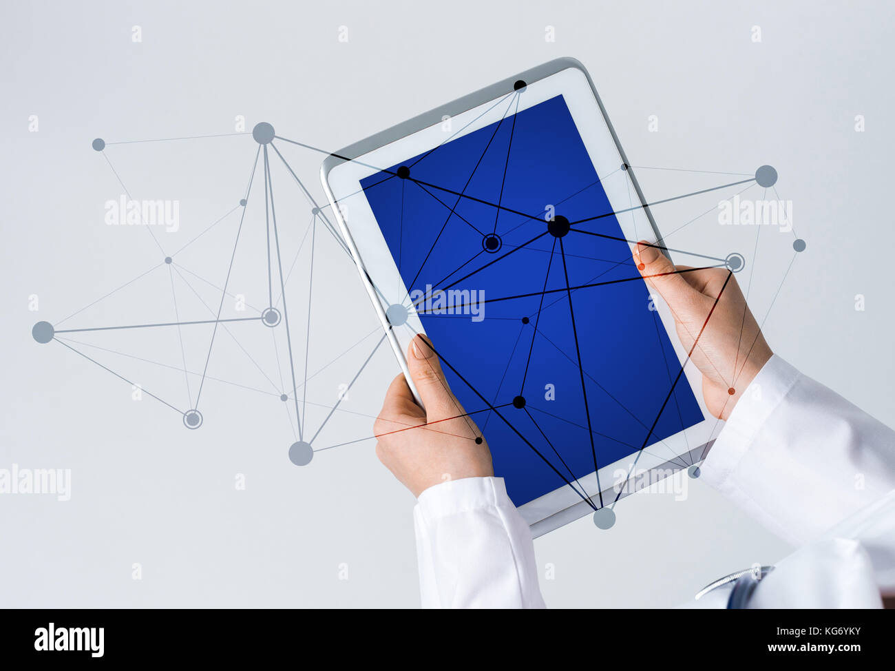 Tablet pc device with connection lines on screen in hands of doctor ...