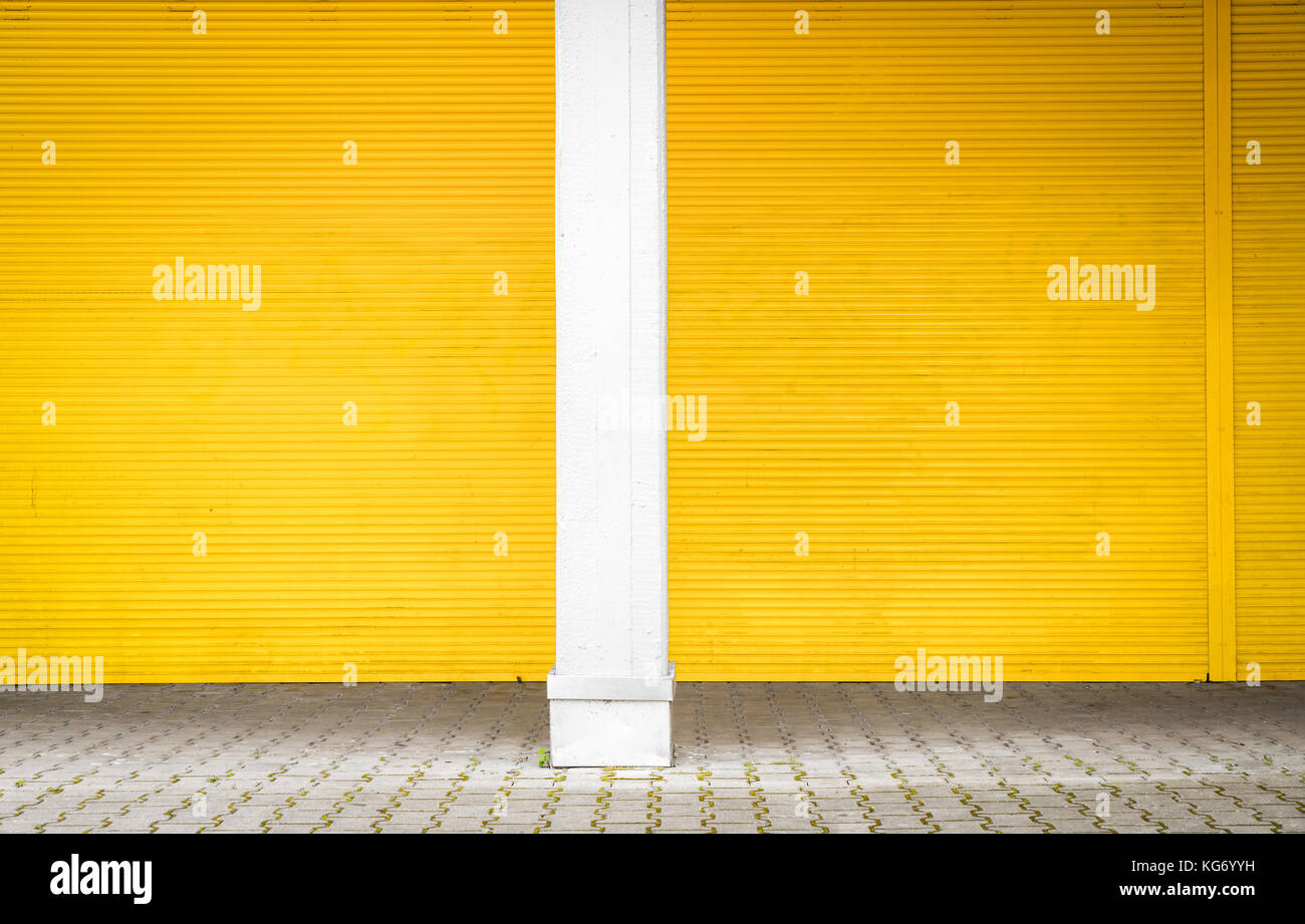 yellow roller shutter and pavement for backgrounds and compositions ...