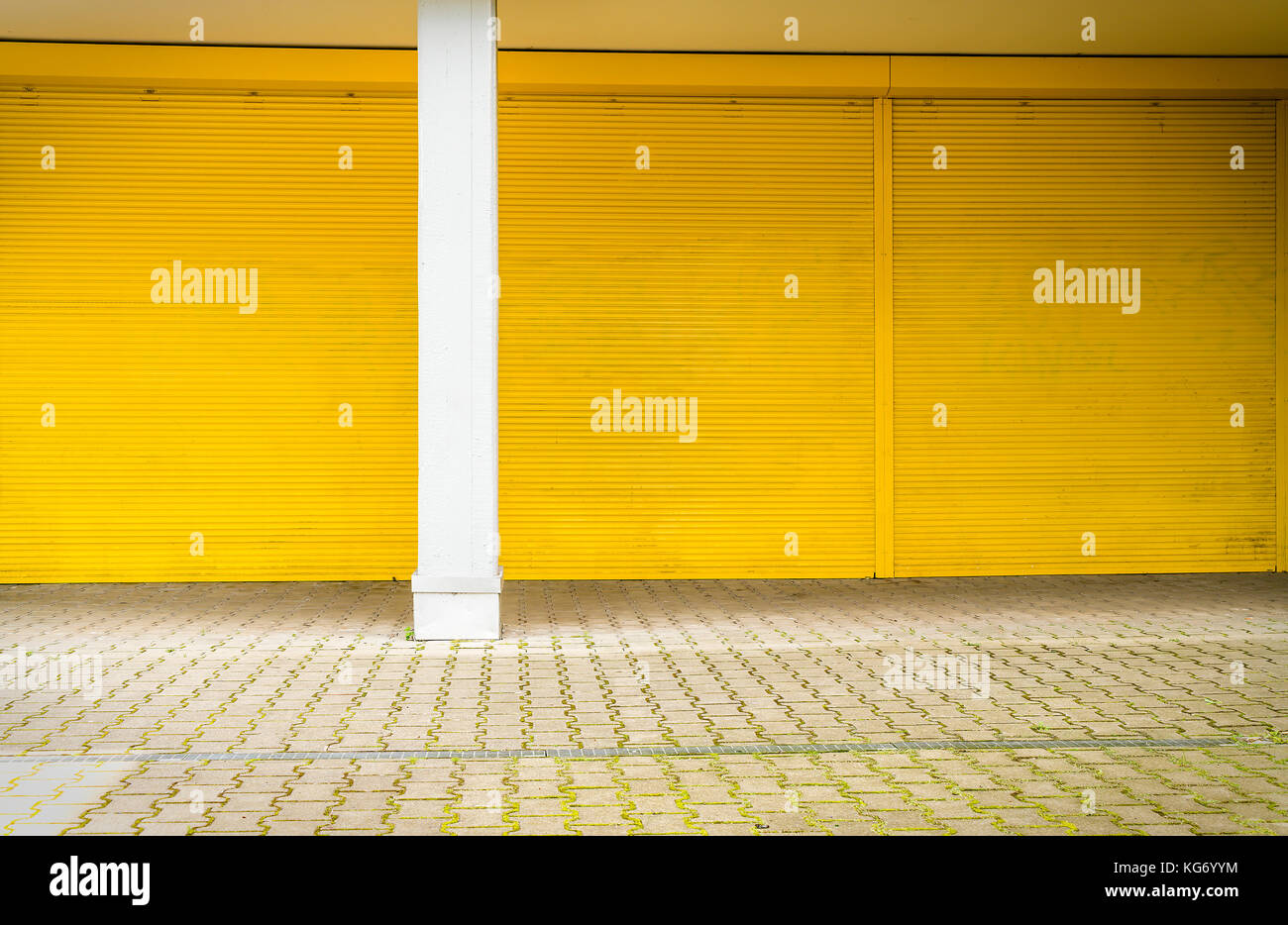 yellow roller shutter and pavement for backgrounds and compositions ...
