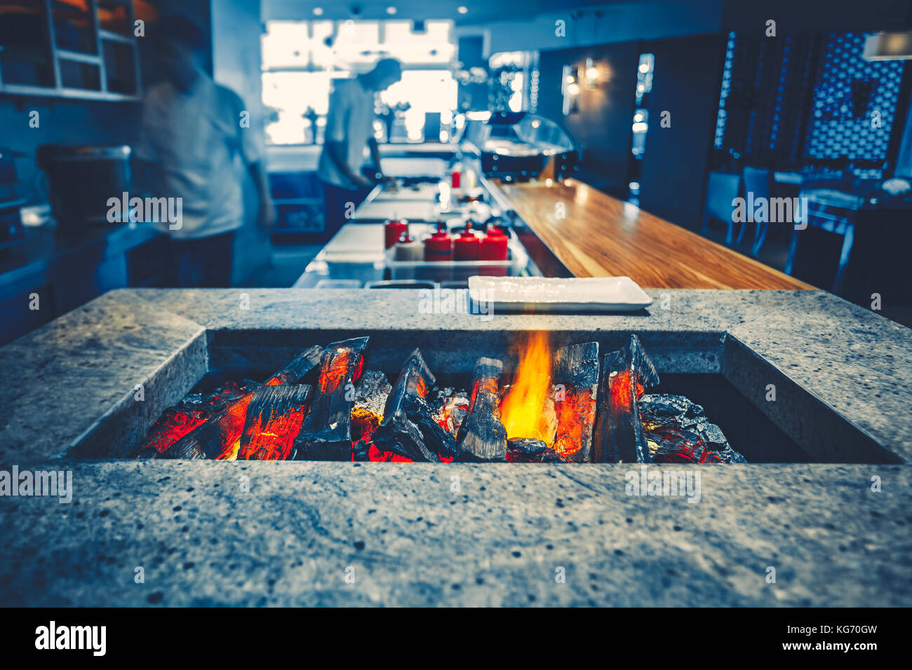 Restaurant kitchen interior: brazier burning wood Stock Photo - Alamy