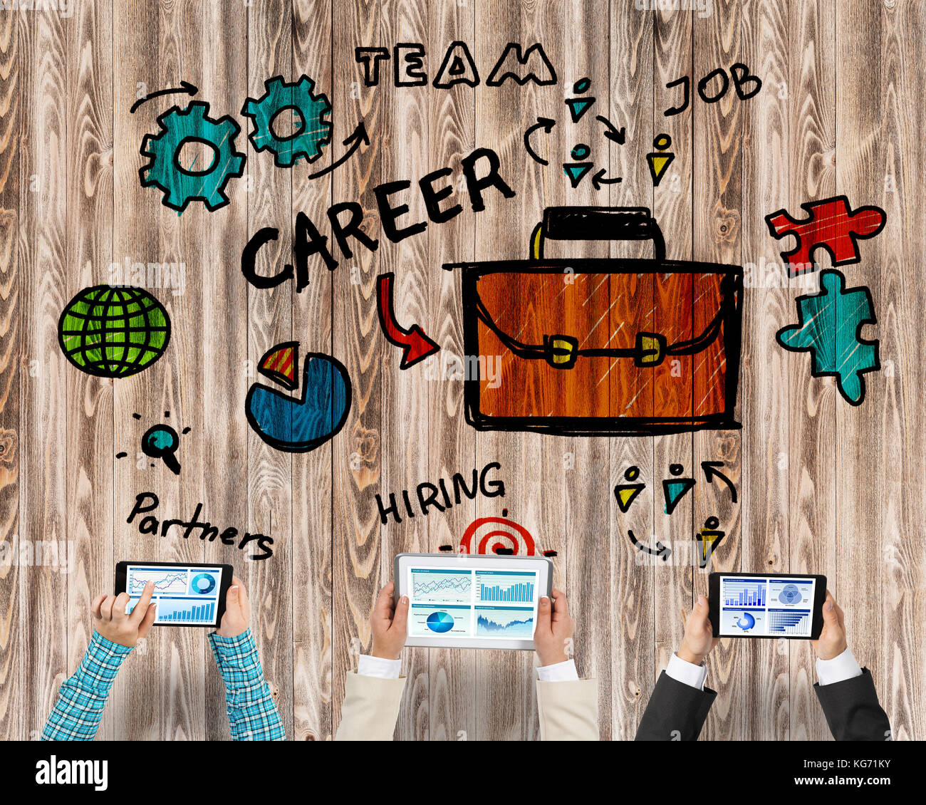 Group of three people with devices in hands working together as symbol ...