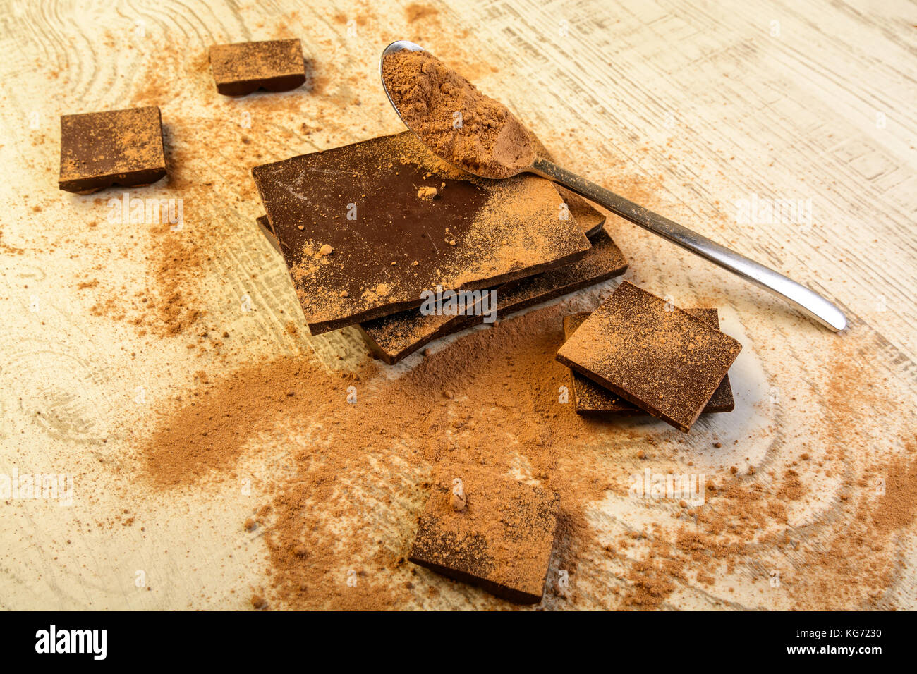 chocolate tablets with pieces on different sizes on bright wood ...