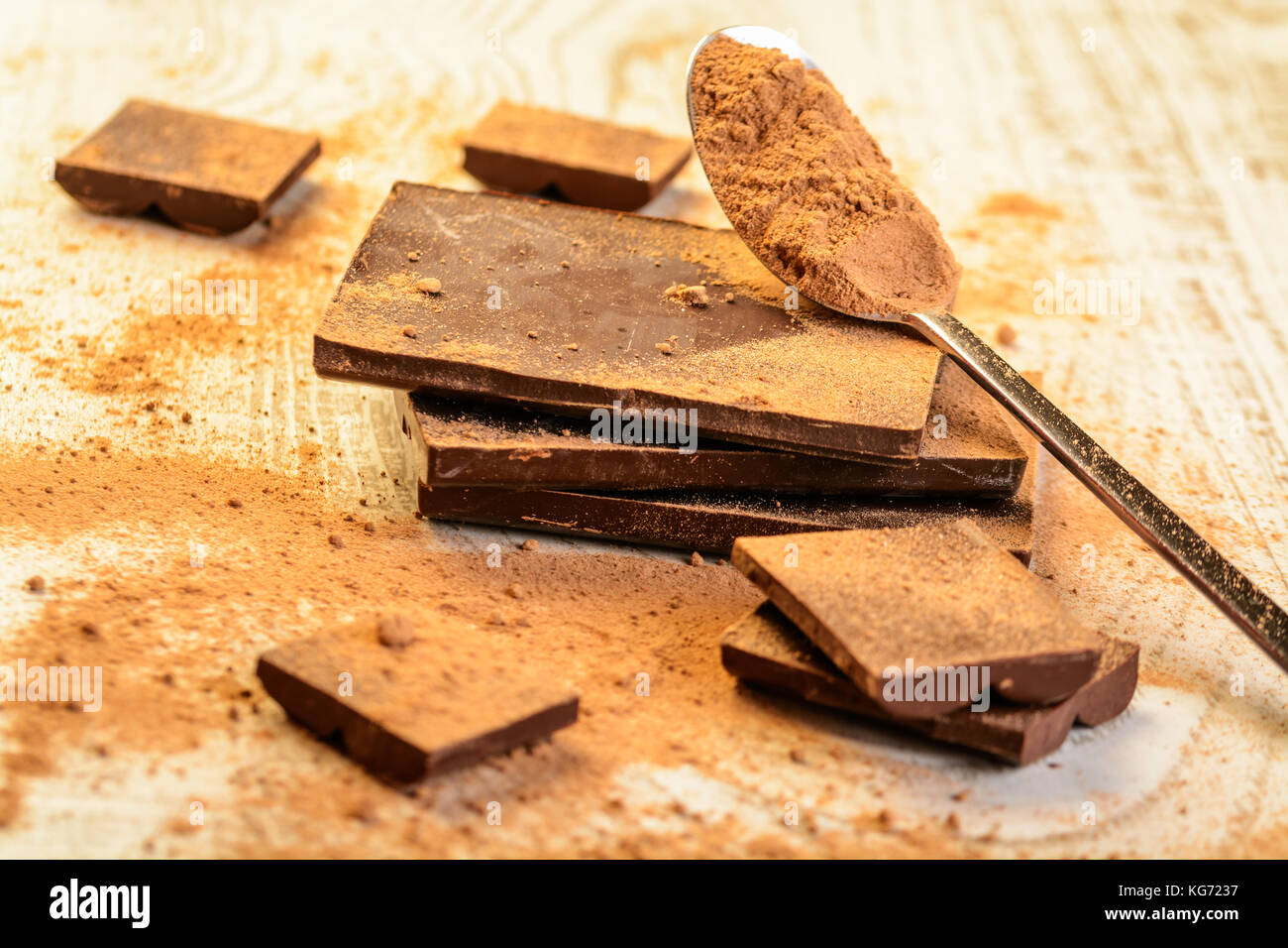 chocolate tablets with pieces on different sizes on bright wood ...