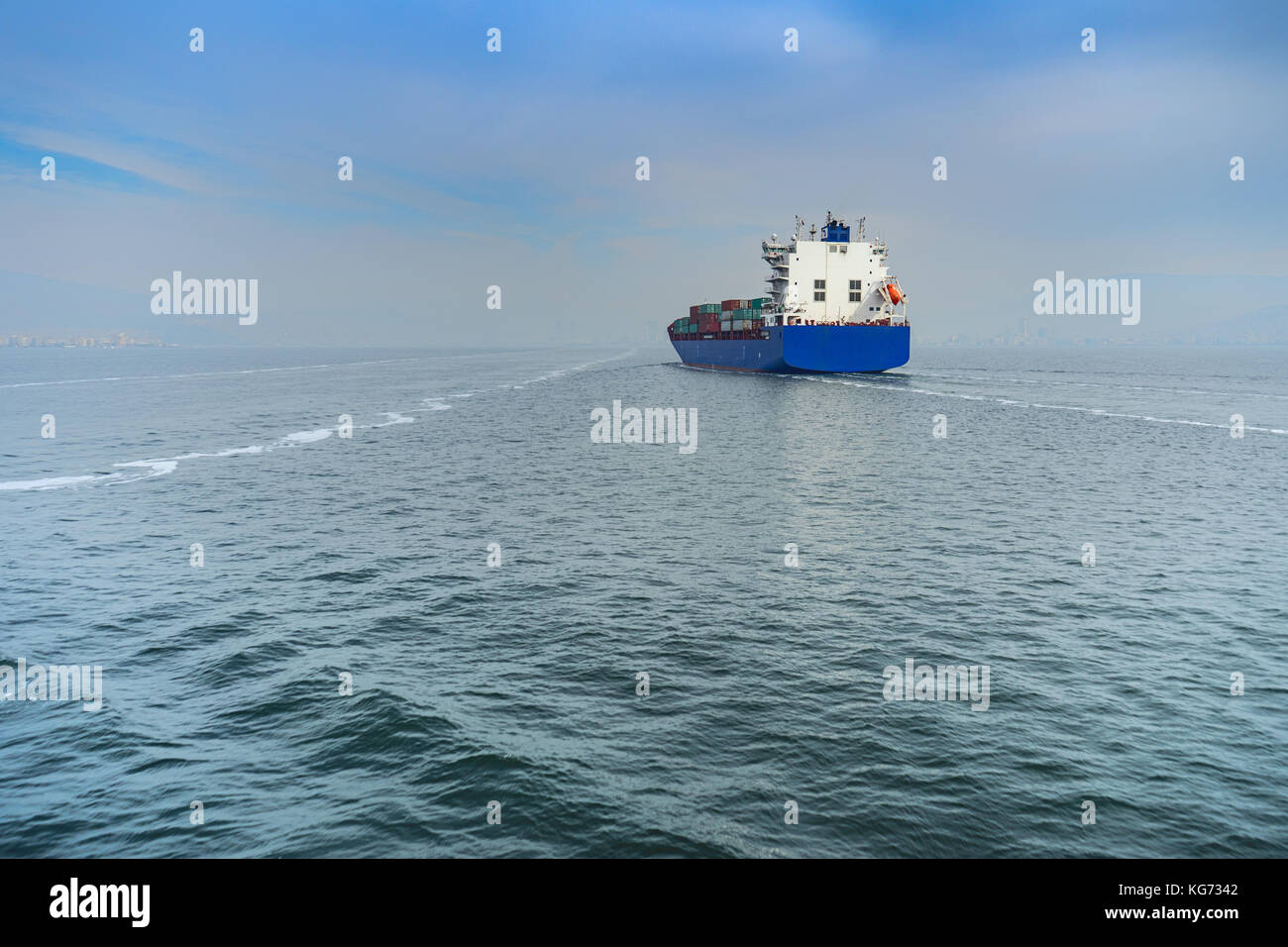 the blue container ship cruising at sea Stock Photo - Alamy
