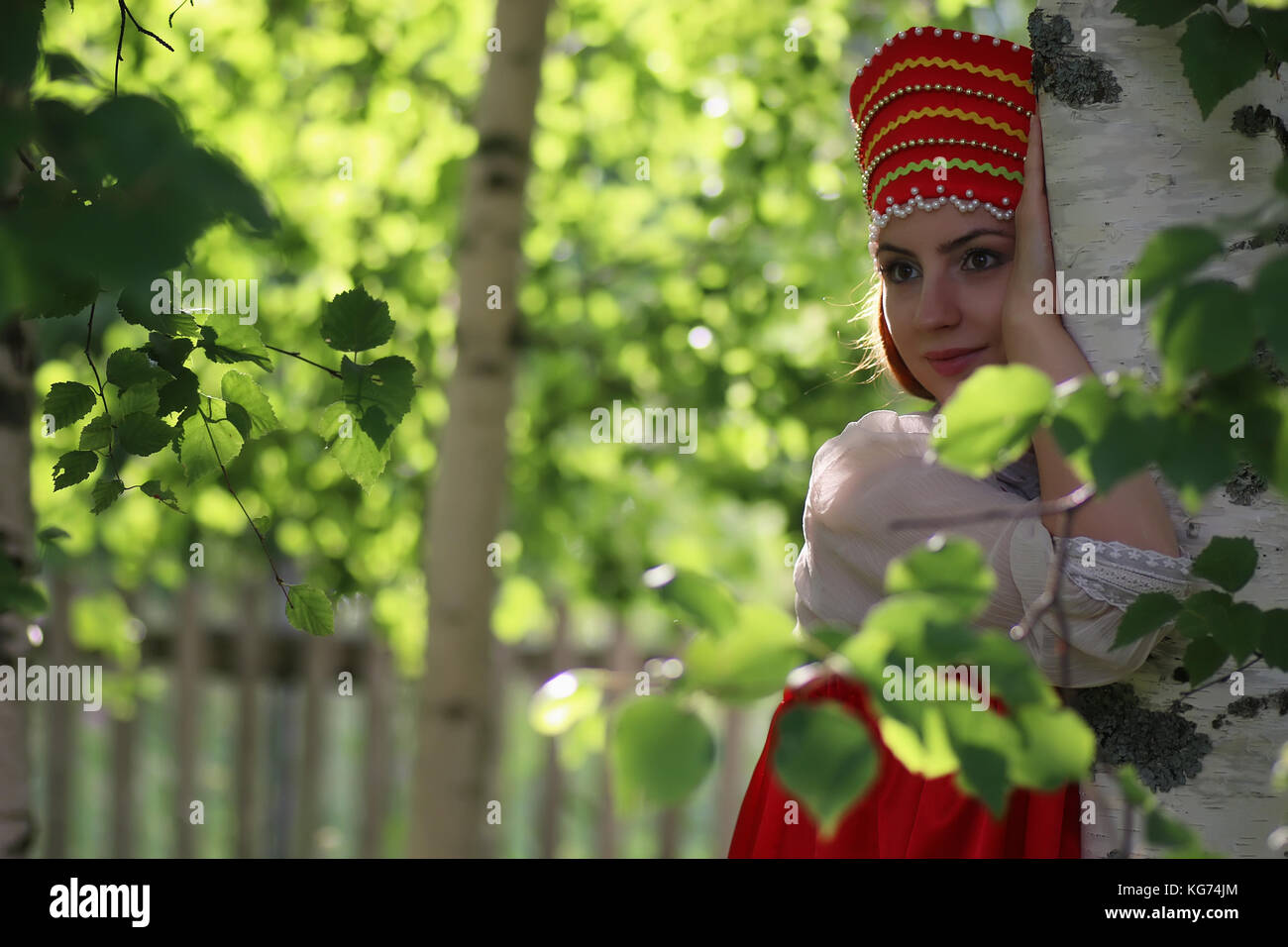 cute pretty girl in a traditional Slavic dress on nature in an unspoilt ...