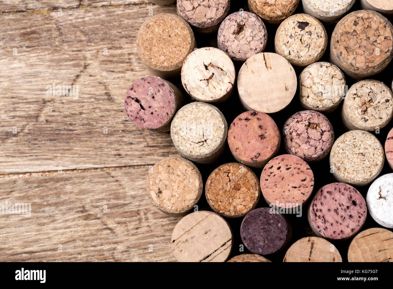Stacked cork background on wuuden table Stock Photo - Alamy