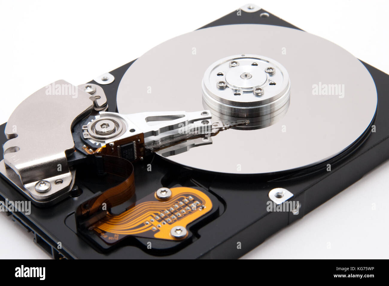 Close up inside of a computer harddrive with reflections of the read ...