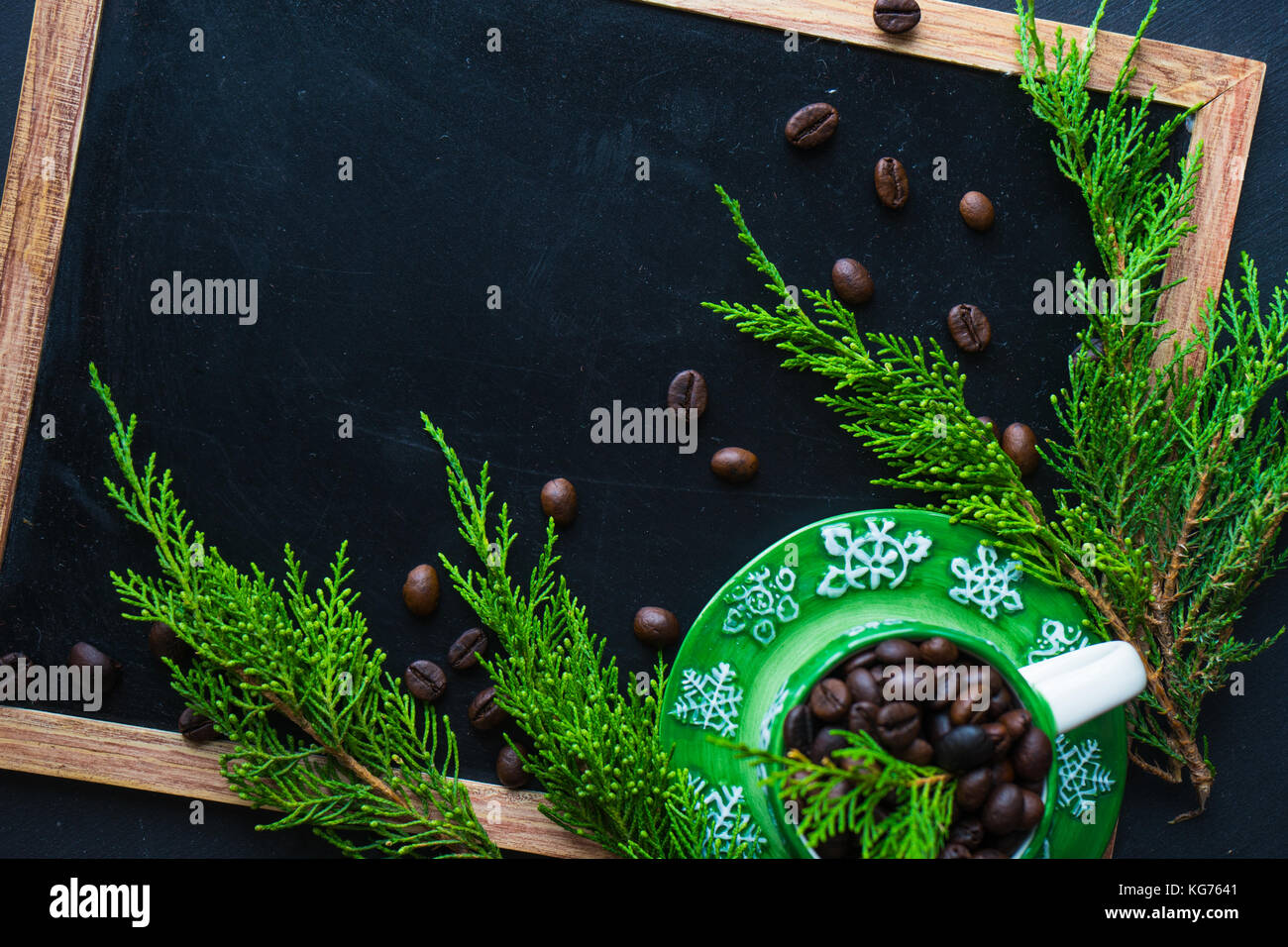 Christmas concet with chalkboard, pine cones and coffee beans on dark ...