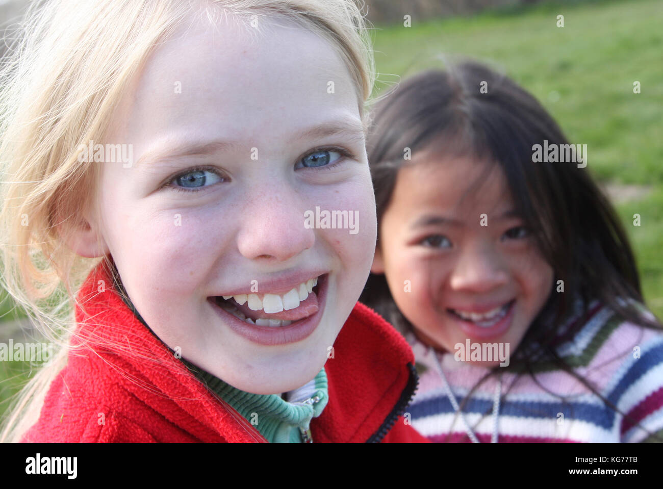Close up of face of happy children while smiling /laughing and playing ...