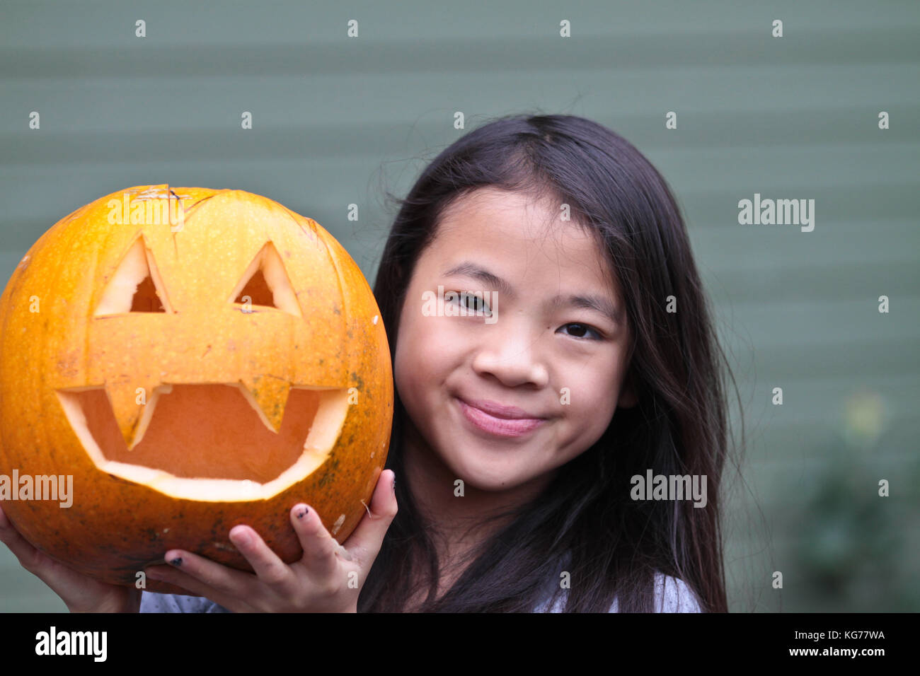 Pumpkin girl having fun at halloween Stock Photo - Alamy
