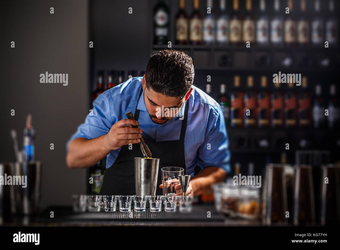 Bartender preparing an alcoholic beverage in a restaurant bar Stock ...
