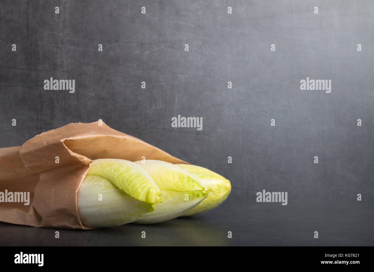 belgian endives close up on a table Stock Photo - Alamy