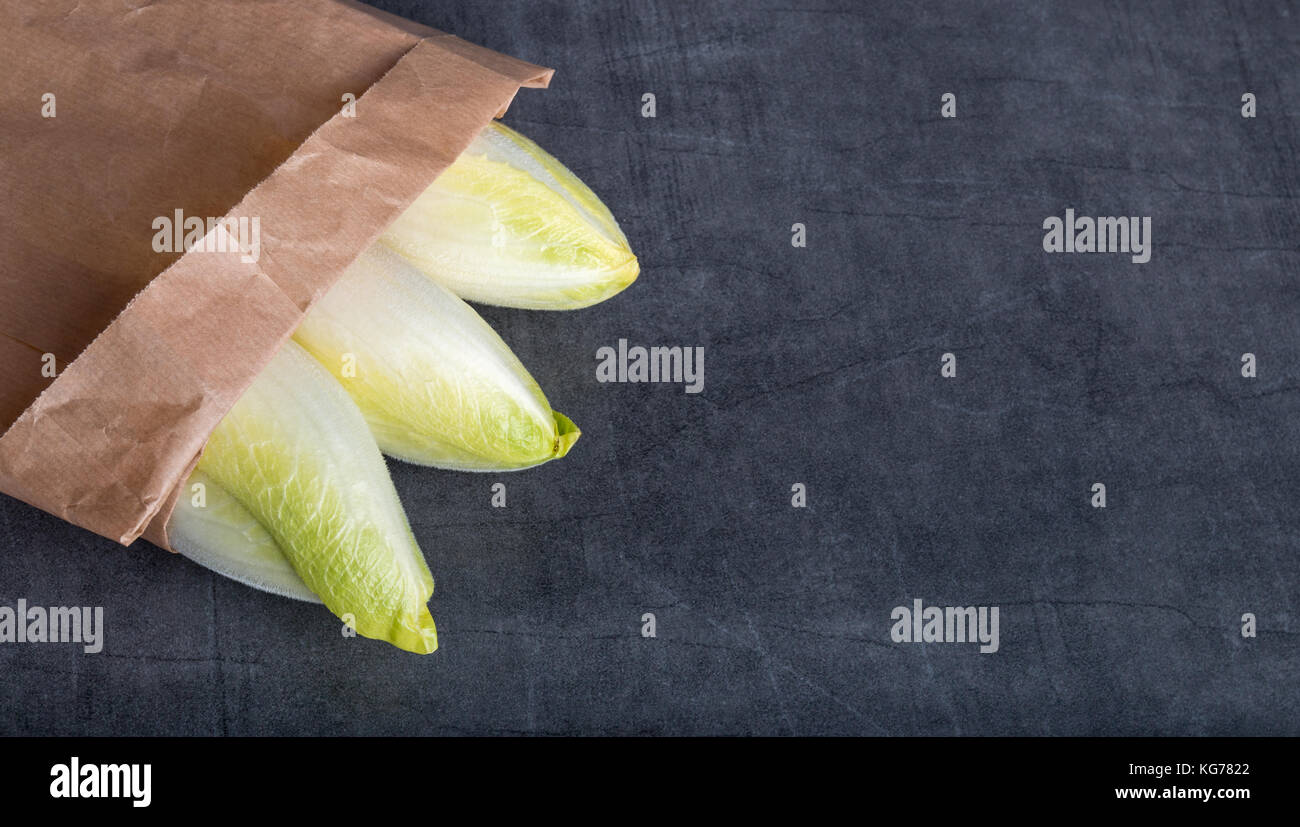 belgian endives close up on a table top view Stock Photo - Alamy
