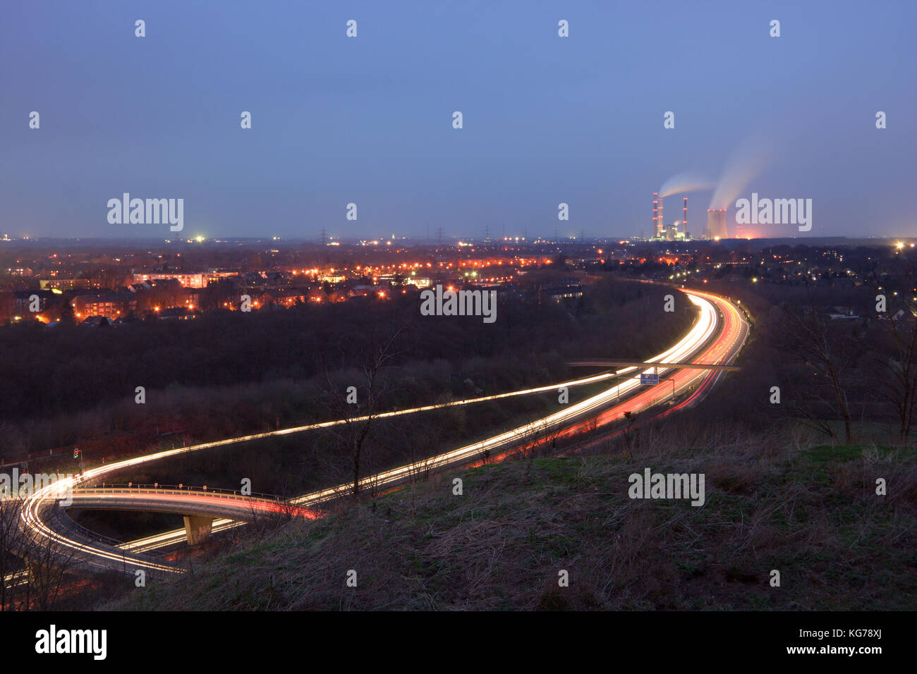 Light trails on a german Autobahn, a power station in the background ...