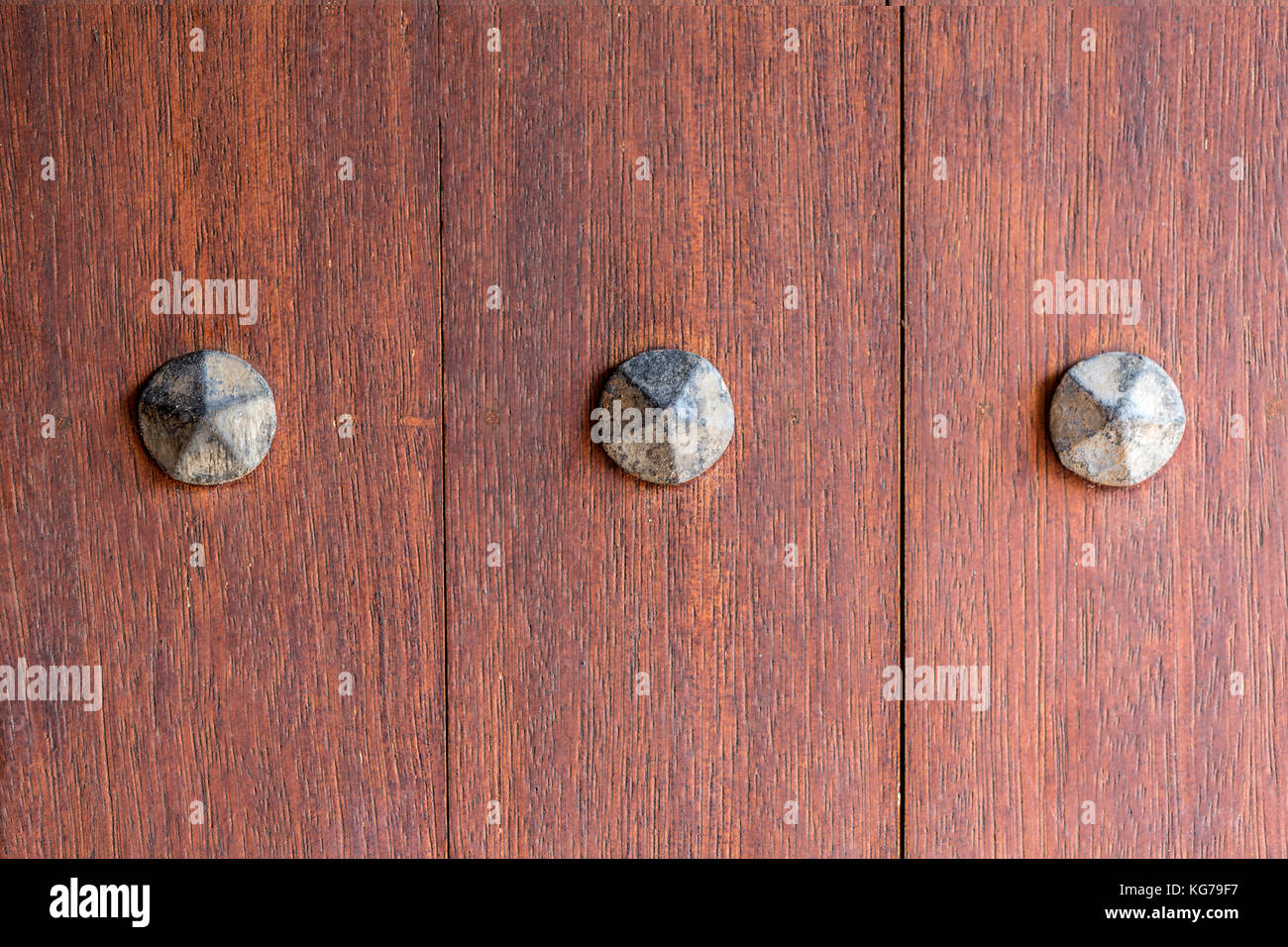 Vintage Copper nails in the door. background Stock Photo - Alamy