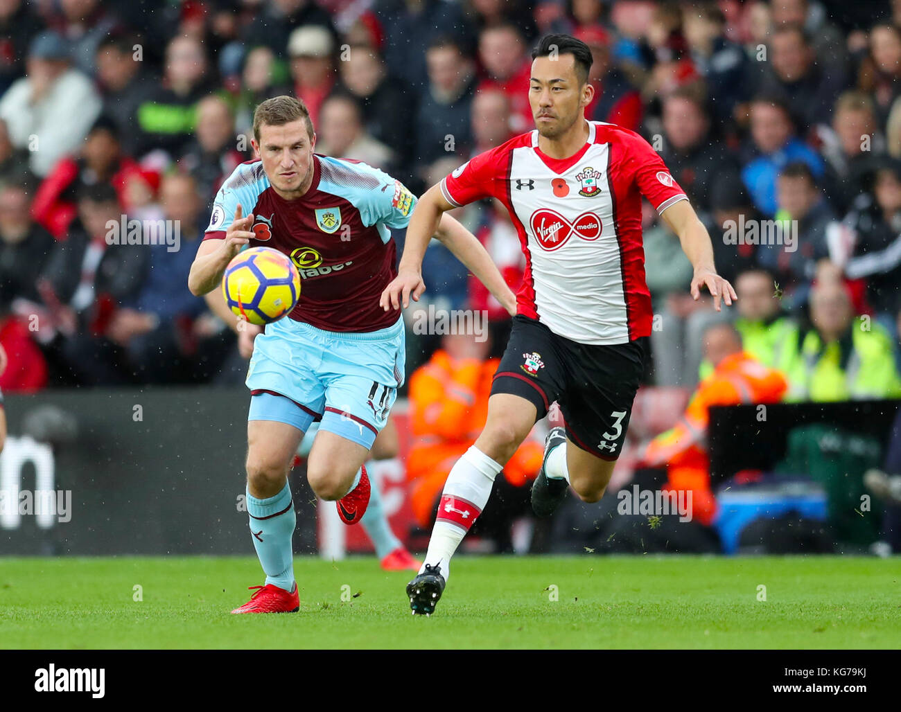 Burnley's Chris Wood (left) and Southampton's Maya Yoshida battle for ...