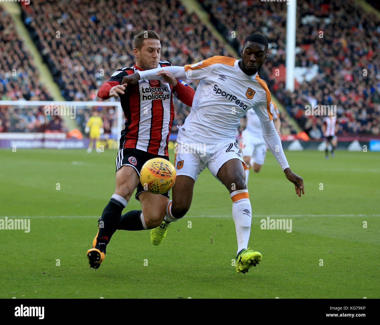 Sheffield United's Billy Sharp (left) and Hull City's Fikayo Tomori ...