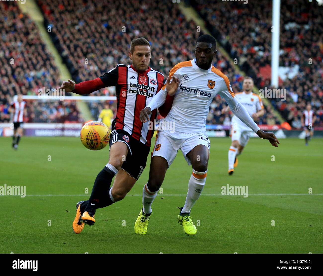 Sheffield United's Billy Sharp (left) and Hull City's Fikayo Tomori ...