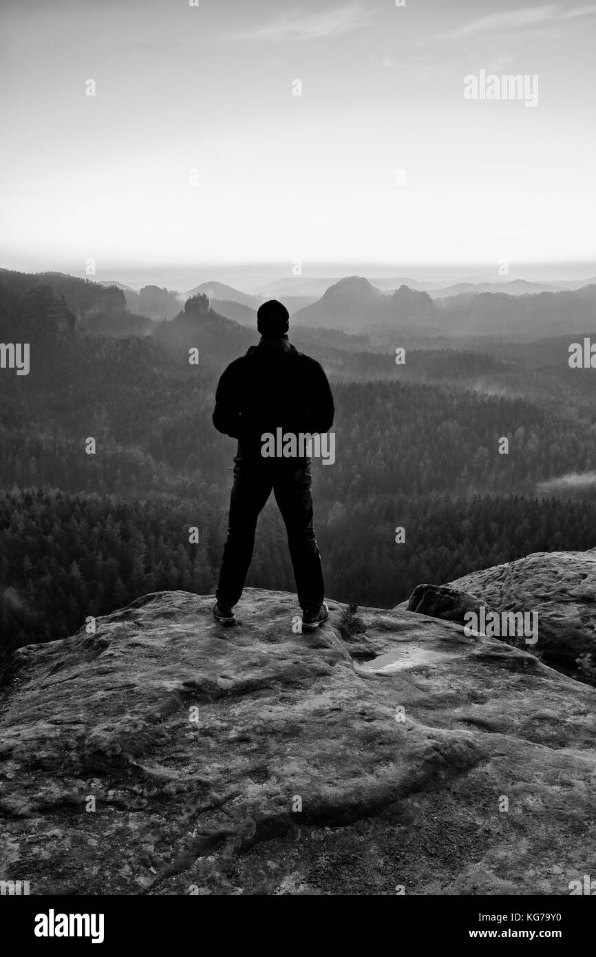 Man on sandstone rock watching to Sun. Beautiful moment the miracle of ...
