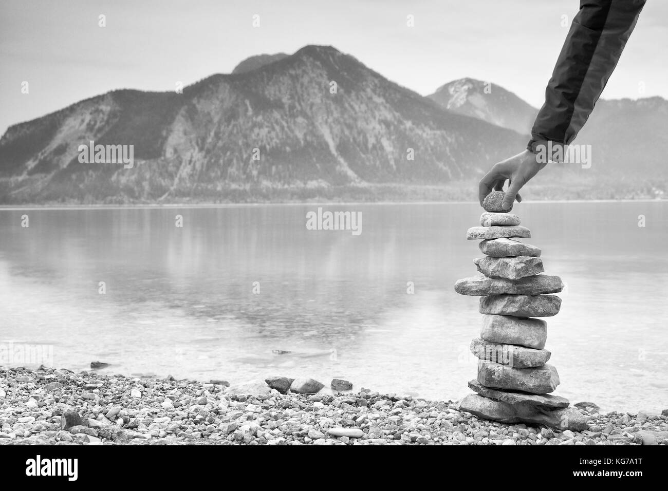 Man built pyramid from pebbles. Balanced stone pyramide on shore of ...