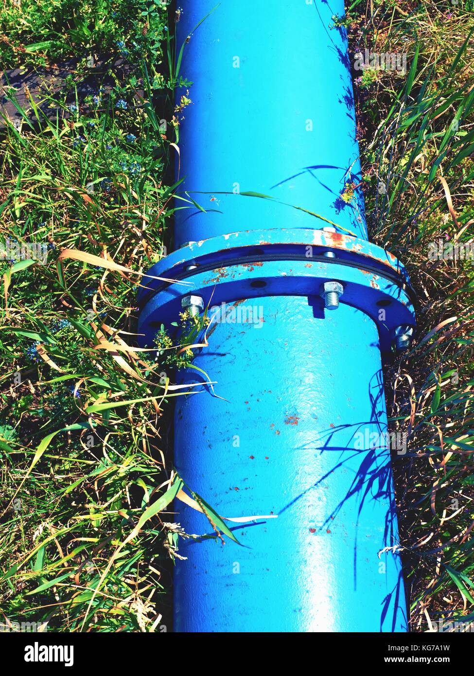 Repaired big drink water pipes joined with new blue flanges and silver ...