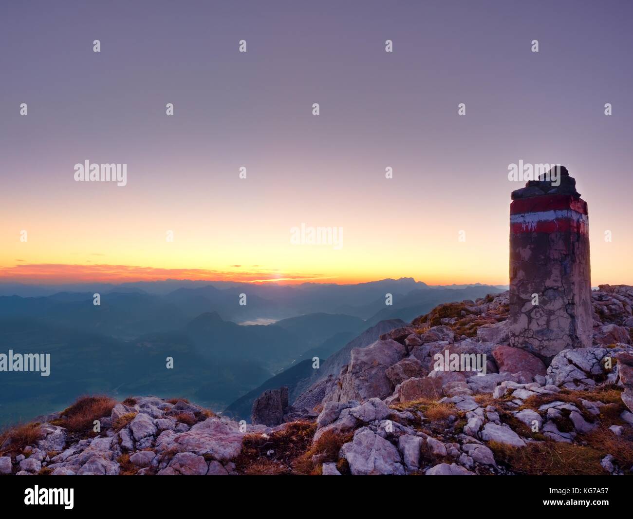 National border stone on Apine gravel cliff. Austria Germany border ...