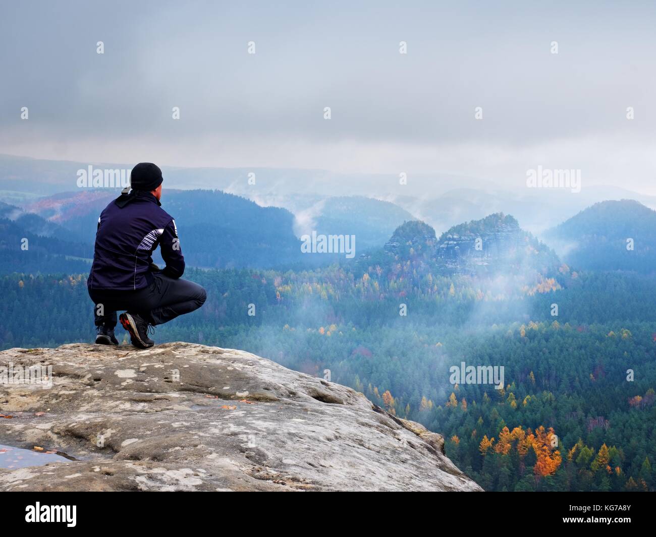 Hiker on sharp cliff of sandstone rock in rock empires park and ...