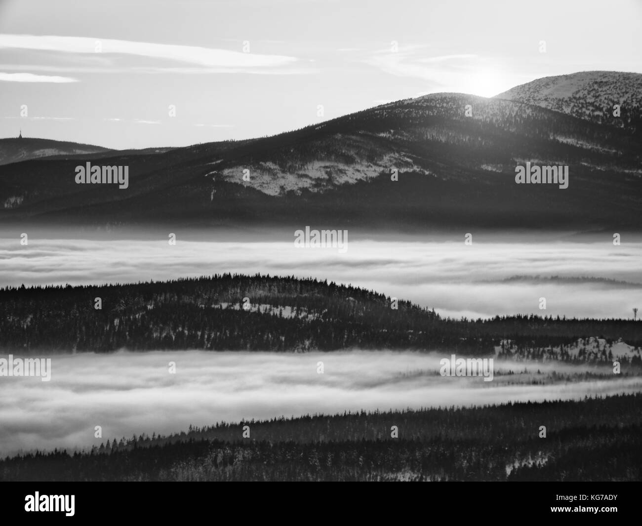 Chill inverse weather in winter mountains, heavy mist. Valley full of ...