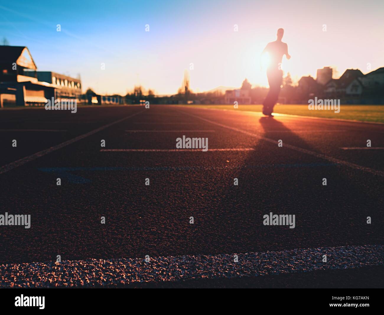 Marathon man training. Sportsman in running clothes on stadium at ...
