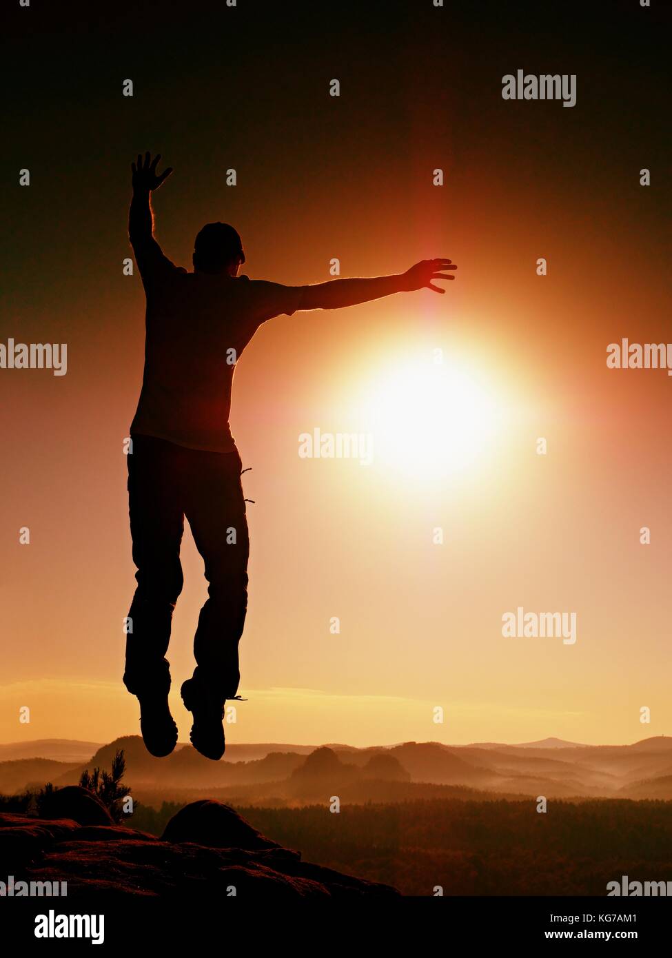 Falling man. Man fly in air. Man falling down with hands up. Sun and ...