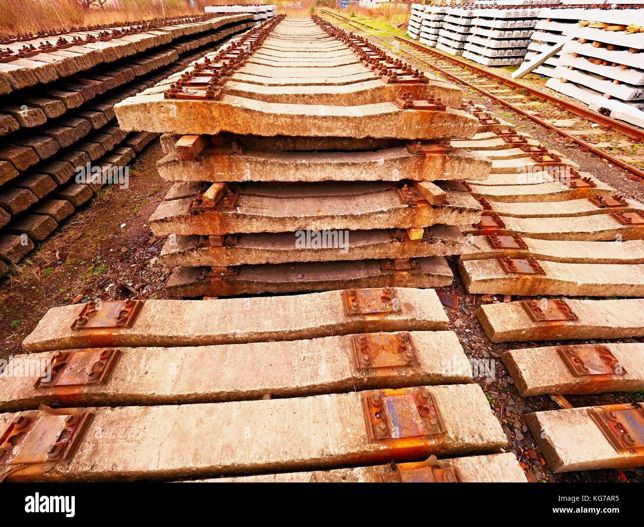 Extracted old concrete sleepers in stock. Old rusty used concrete ...