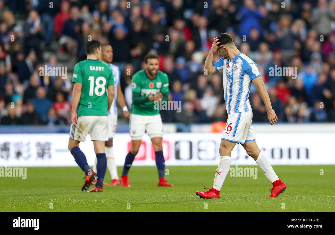 Huddersfield Town's Christopher Schindler (right) leaves the pitc after ...