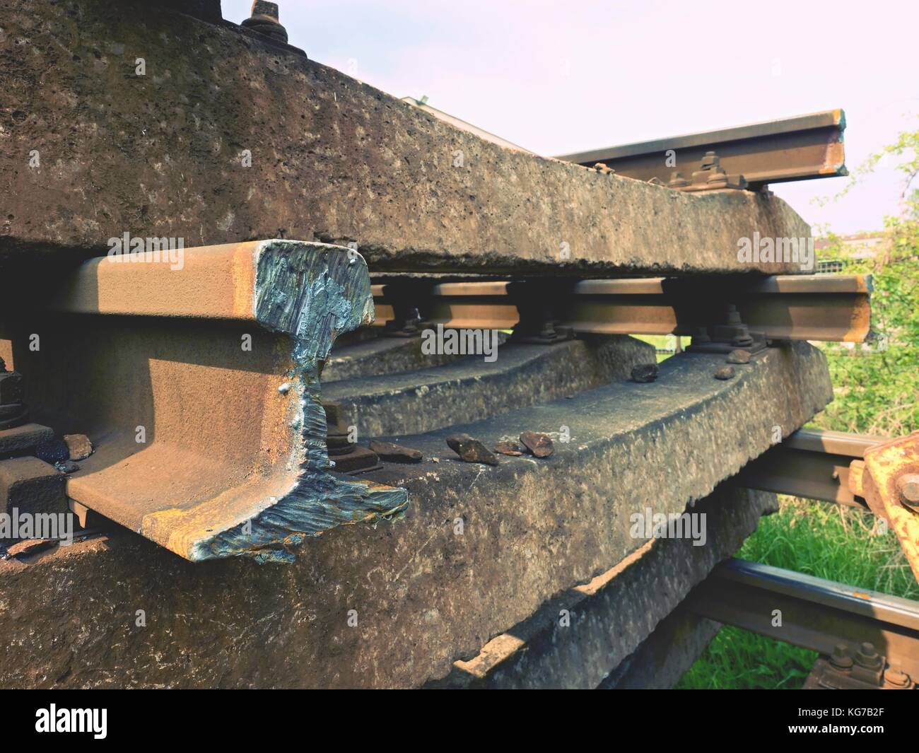 Stolen rail. Detail of autogen torch cut rail rod on concrete sleeper ...