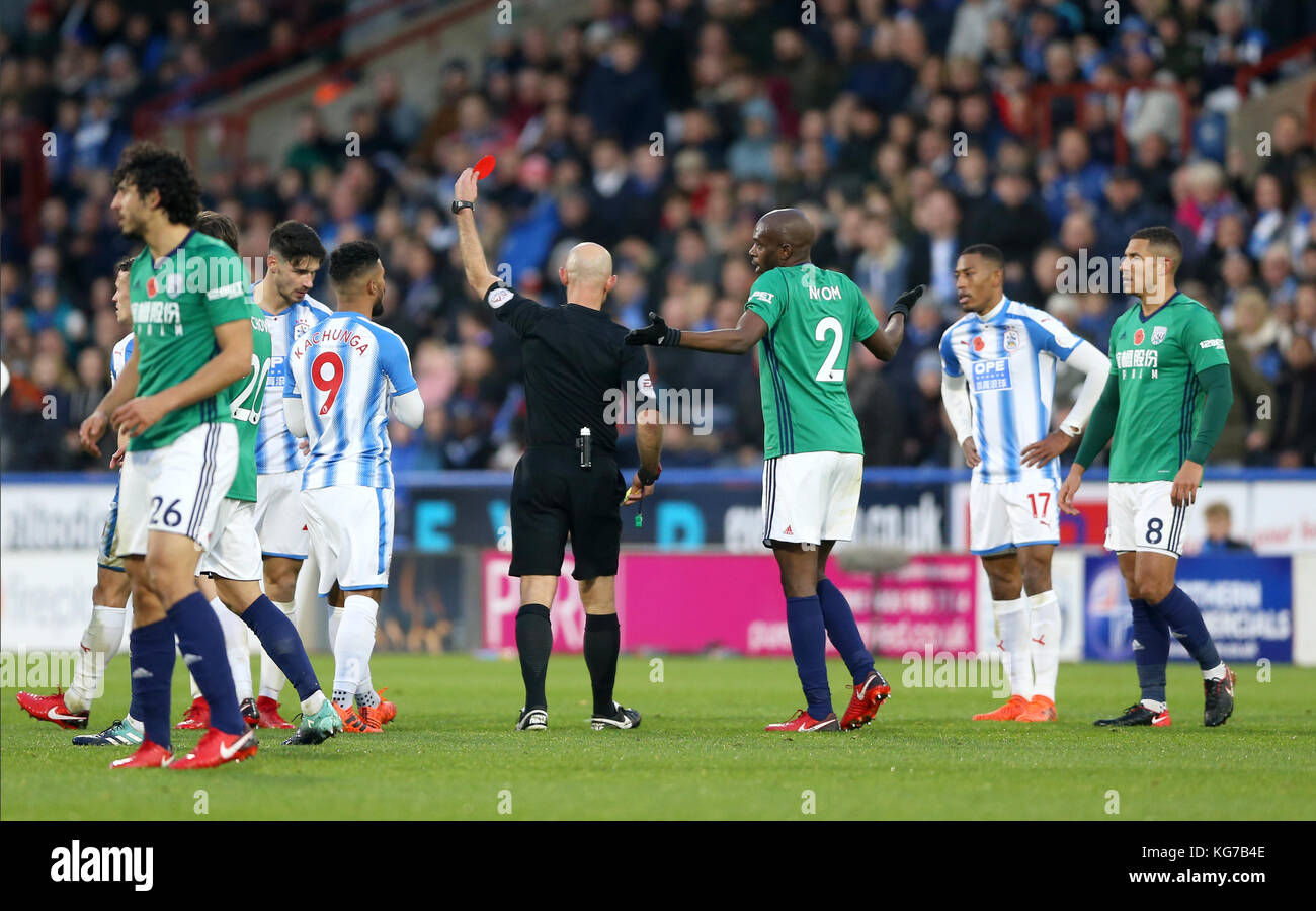 Huddersfield Town's Christopher Schindler is shown the red card by ...