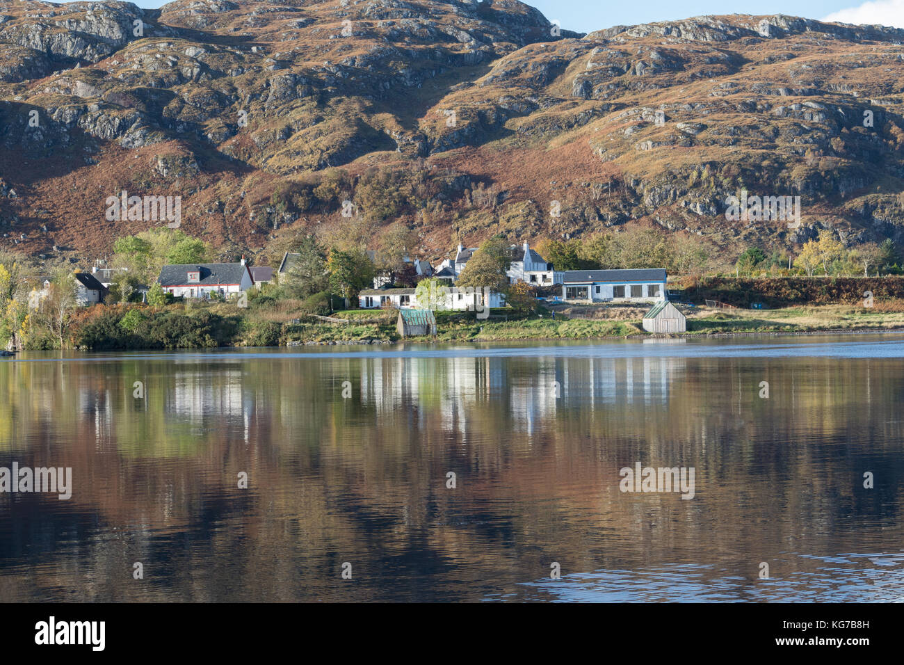 Gairloch harbour with fishing and leisure boats and views from the pier ...