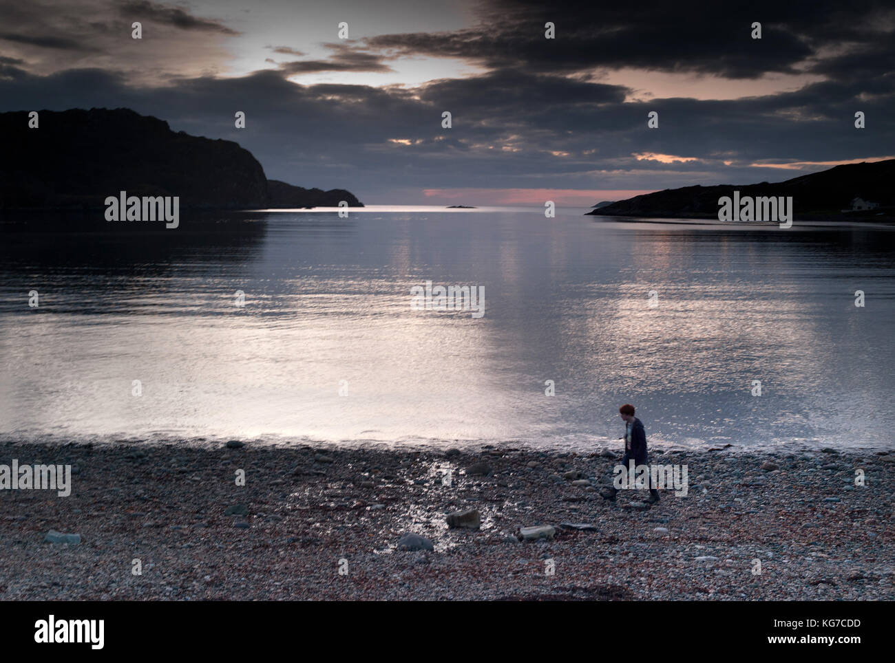 Boy walking on beach of Loch Kirkaig - Inverkirkaig Stock Photo - Alamy