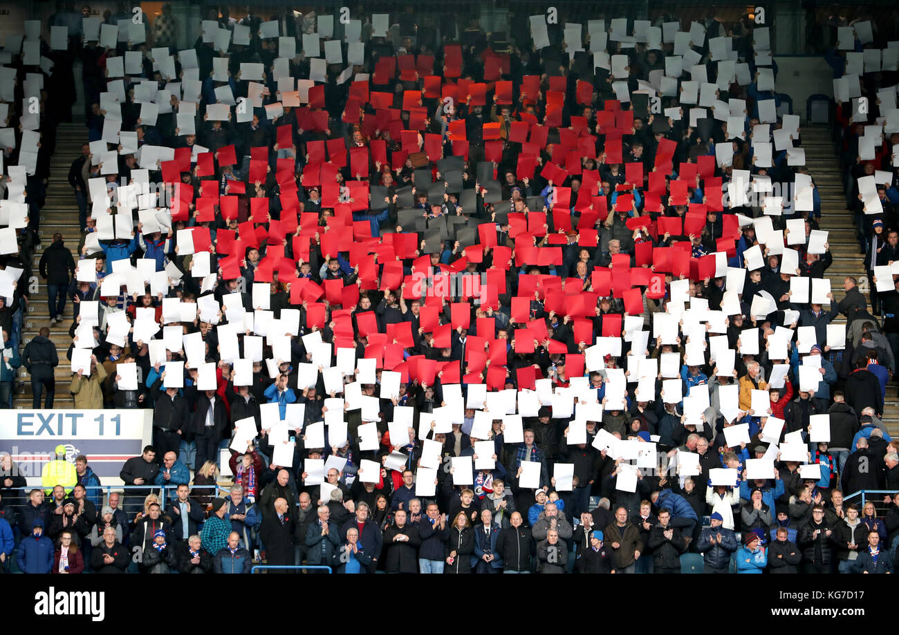 Rangers' fans hold cards to make a poppy ahead of Remembrance Day ...