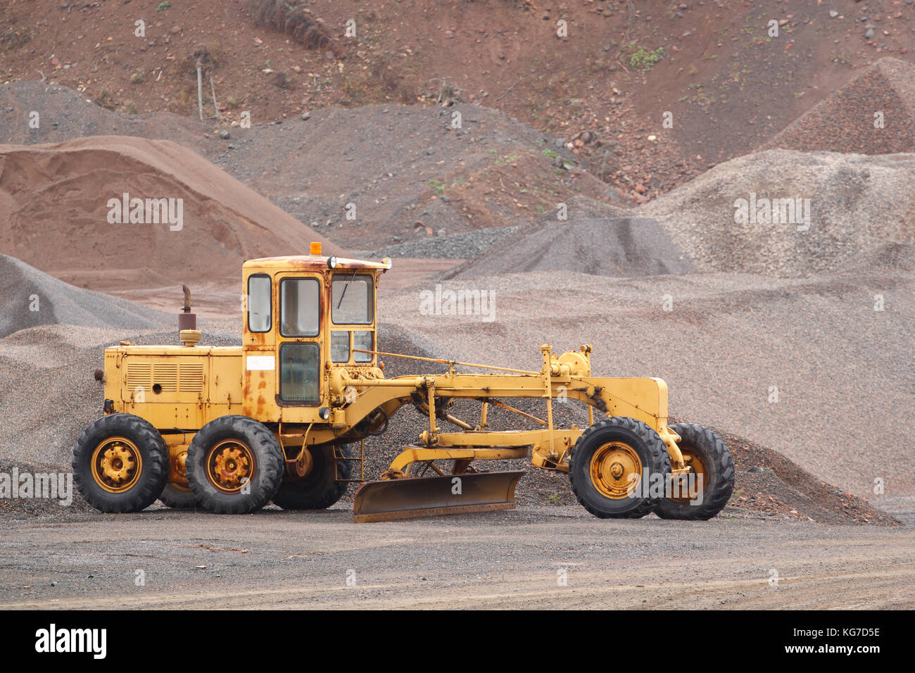 Old road grader in gravel pit Stock Photo - Alamy