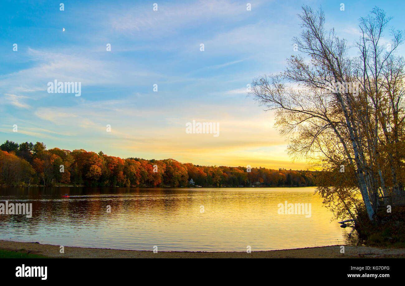 Colors abound as fall foliage borders a pond in Oakland, ME Stock Photo ...