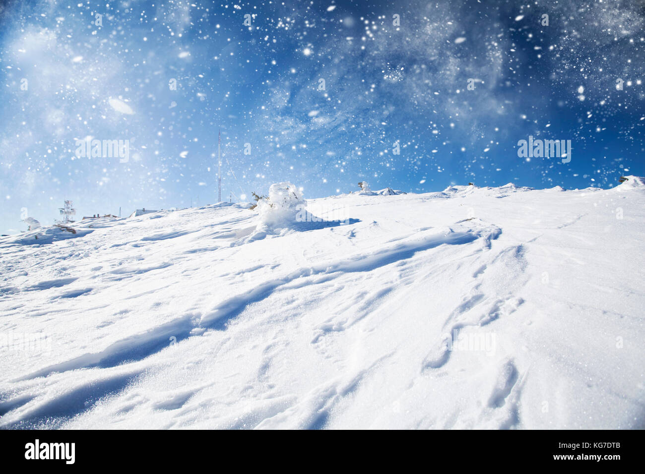 Snow covered hillside in the high mountains in bright sunshine Stock ...