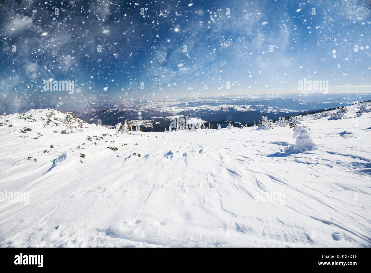 Snow covered hillside in the high mountains in bright sunshine Stock ...