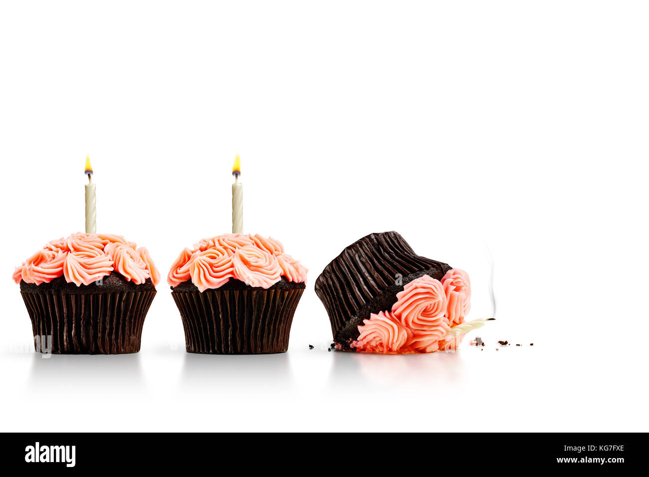 Smashed cupcake in row of cupcakes with candles isolated on white Stock ...