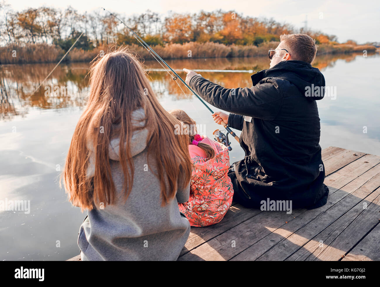 family on autumn fishing Stock Photo - Alamy