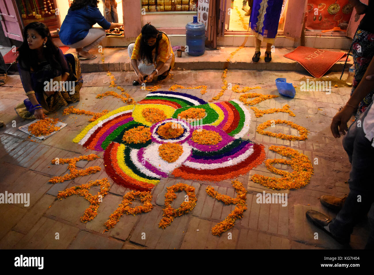 Mandles inside and outside shops in a shopping center Stock Photo - Alamy