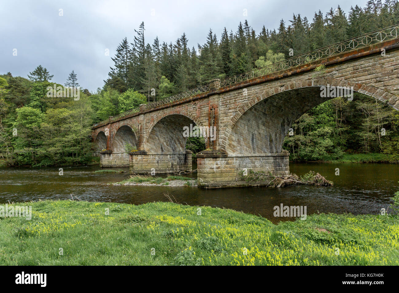 Neidpath viaduct crosses the River Tweed just outside Peebles in the ...